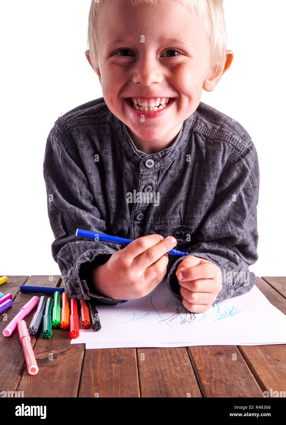Small boy drawing colorful crayons hi-res stock photography and images ...