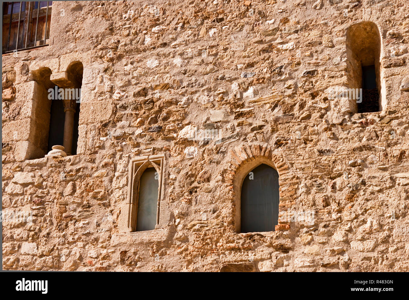 Facade with windows in the romanesque monastery of Sant Cugat Stock ...