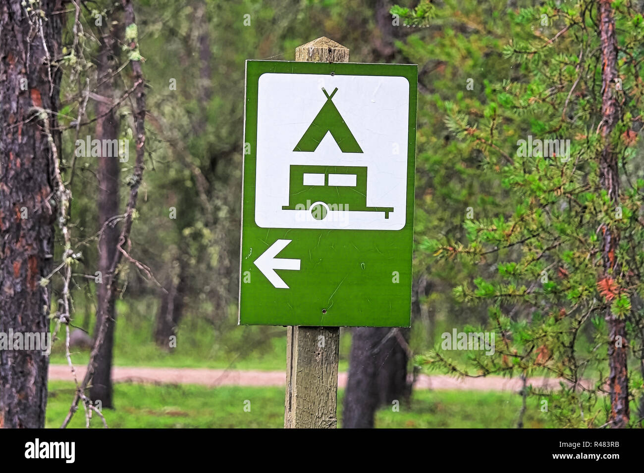 A camping direction sign with an arrow Stock Photo - Alamy