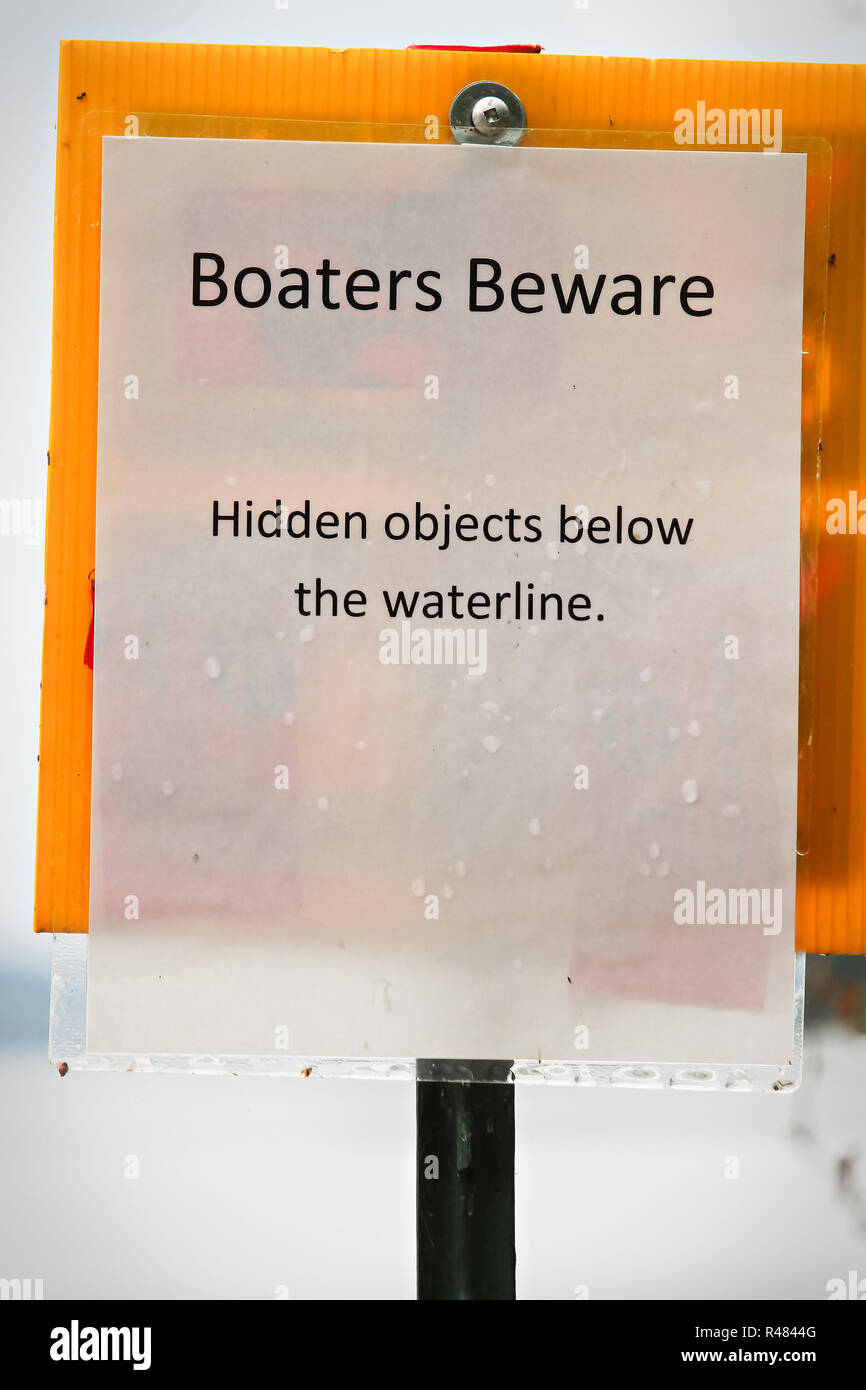 A boaters beware hidden object under water sign Stock Photo - Alamy