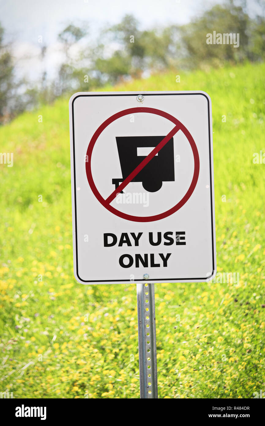 Closeup of a day use only sign Stock Photo - Alamy