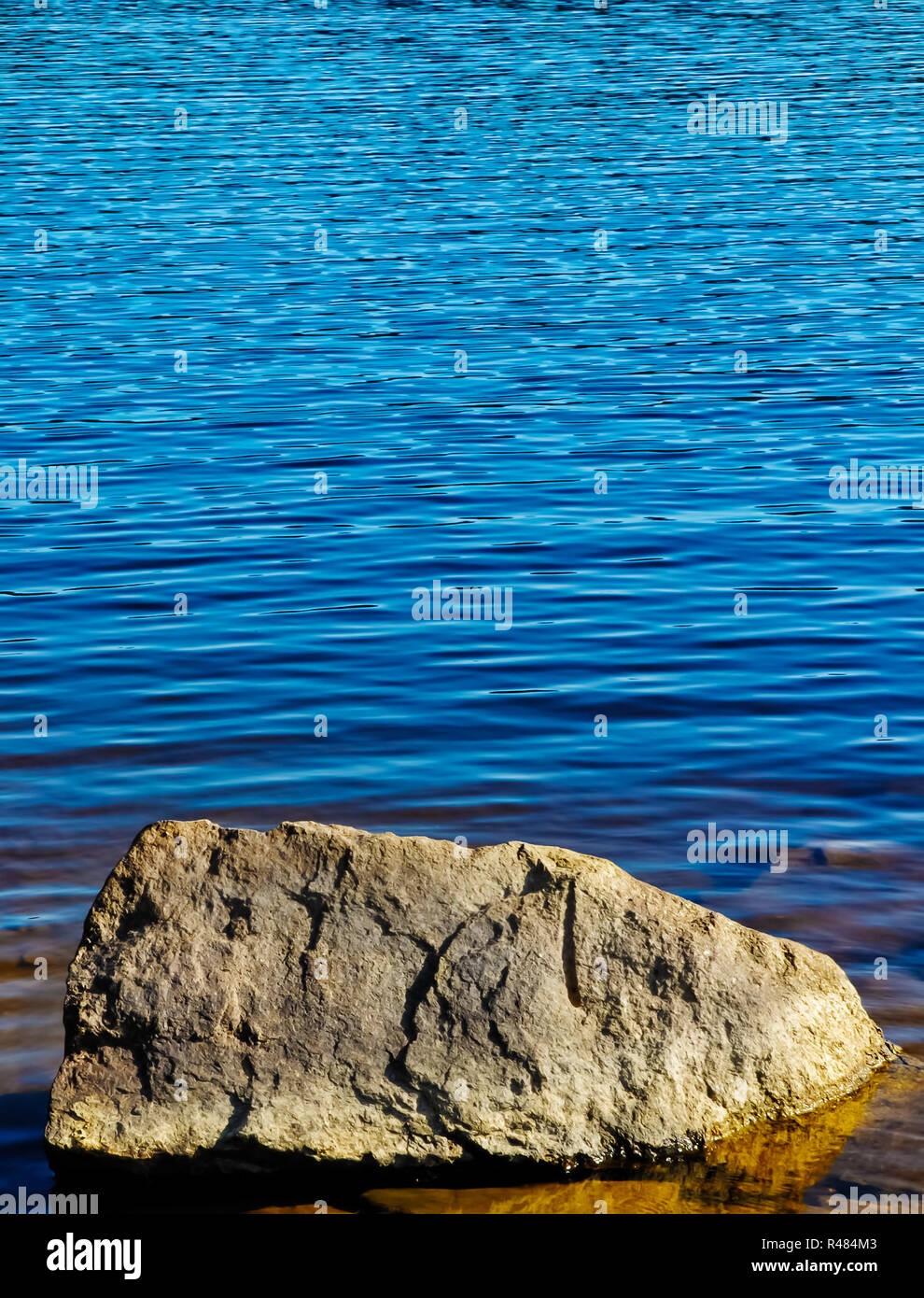 stone in water Stock Photo - Alamy