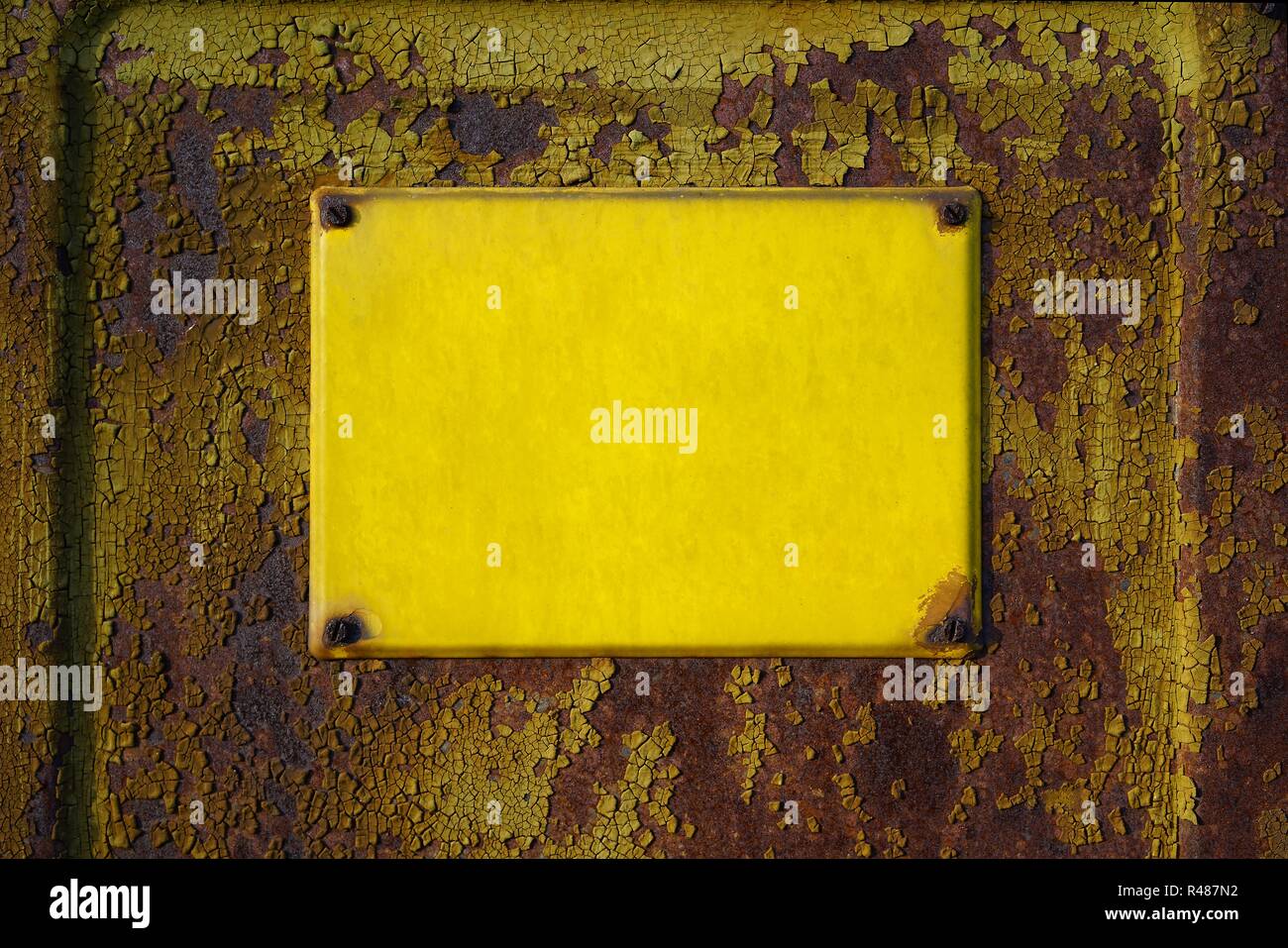 blank yellow sign on a rusted steel door Stock Photo - Alamy
