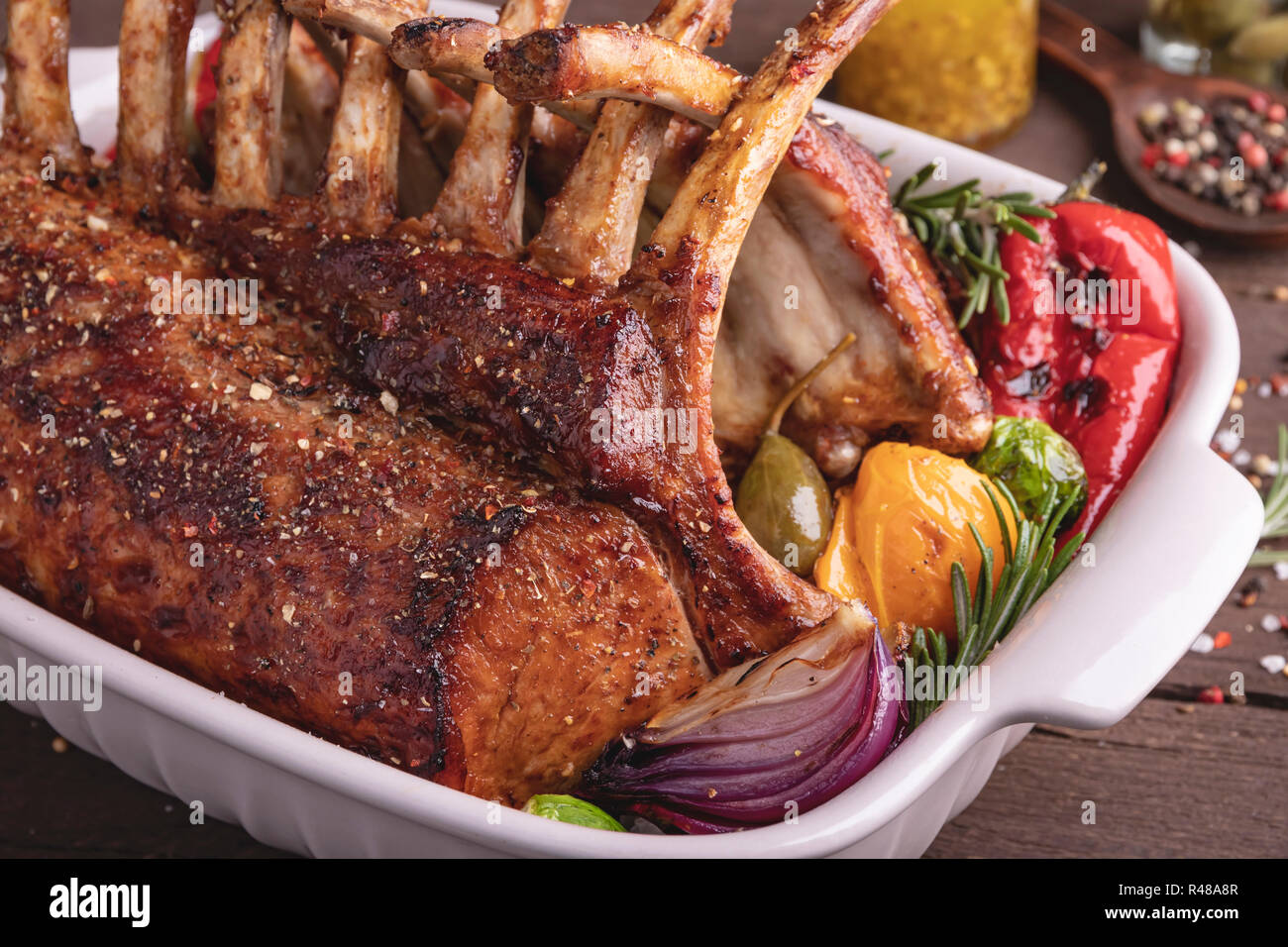 Grilled roasted rack of veal lamb chops with vegetables in ceramic ...