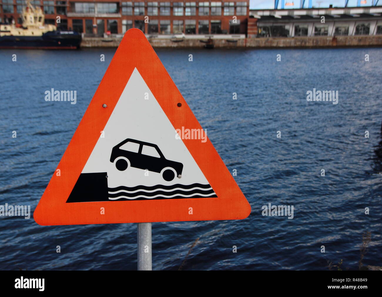 Sign Car Driving into Harbor on Water Background Stock Photo - Alamy