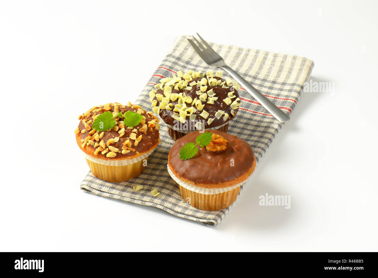 Three assorted muffins Stock Photo - Alamy