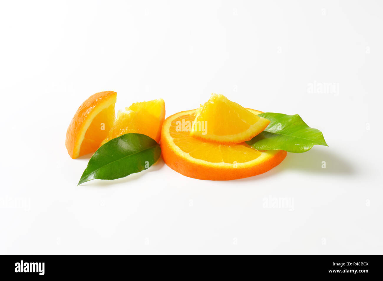 Fresh orange pieces Stock Photo - Alamy