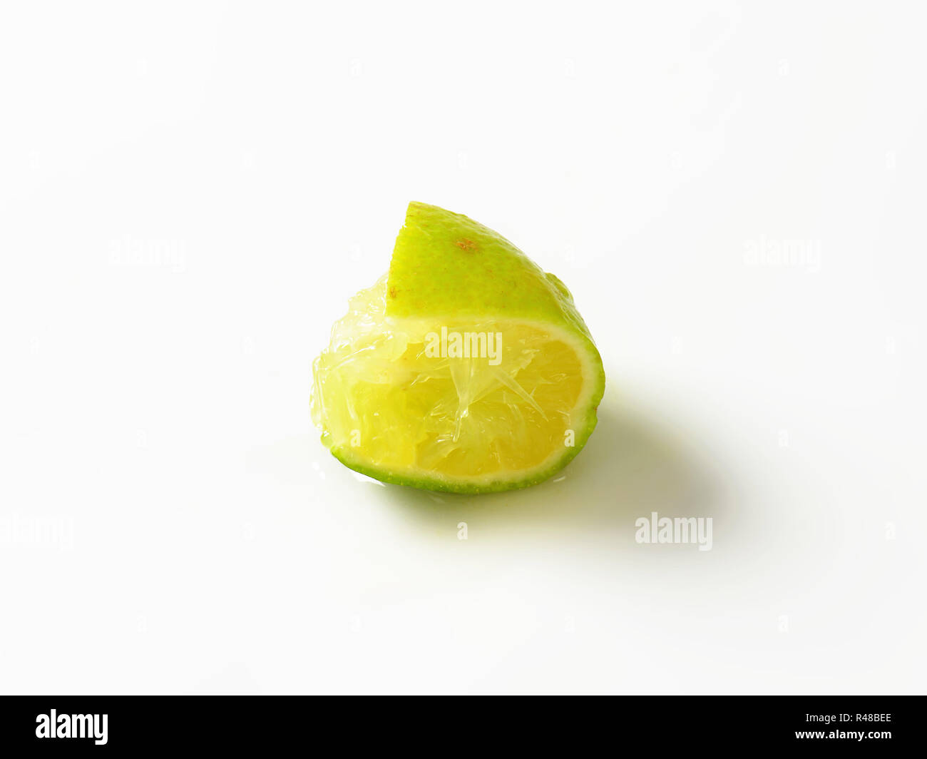Squeezed lime fruit Stock Photo - Alamy