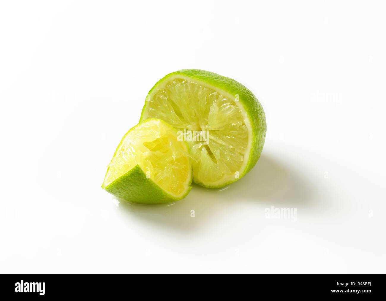Squeezed lime fruit Stock Photo - Alamy