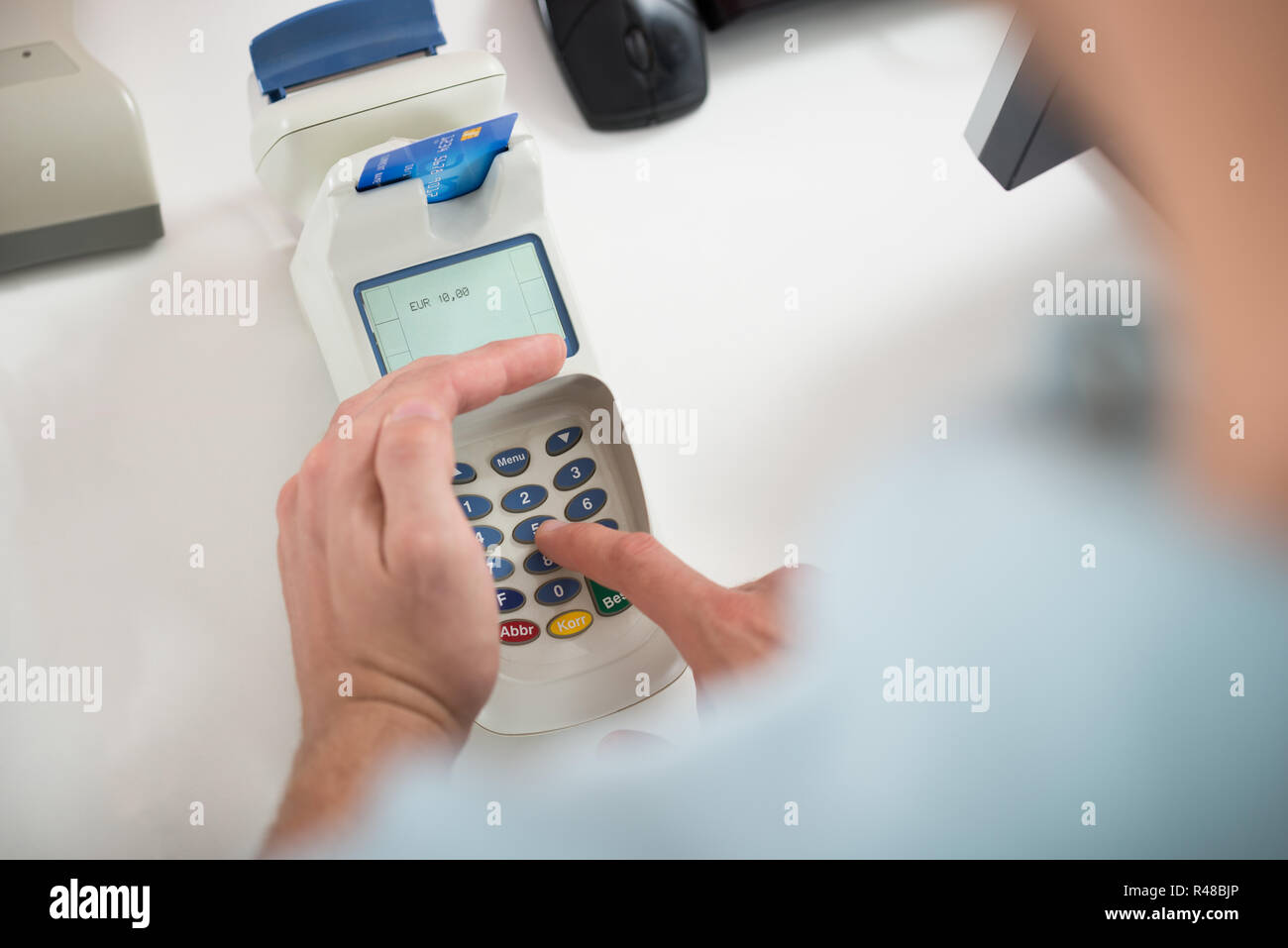Customer's Hand Entering Pin Code On Card Reader Stock Photo - Alamy