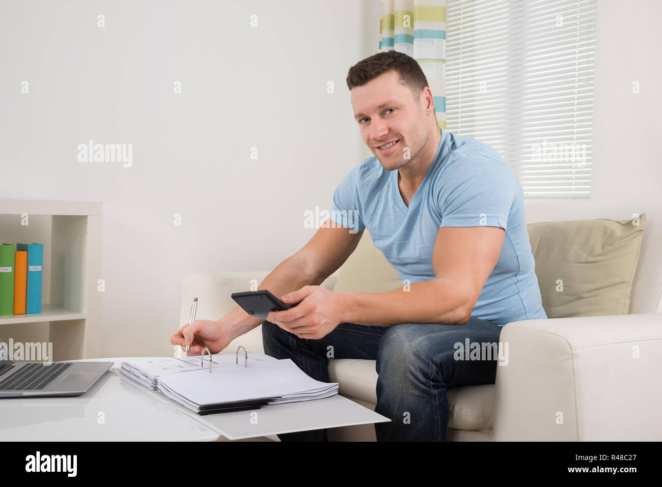 Men calculating bills table home hi-res stock photography and images ...