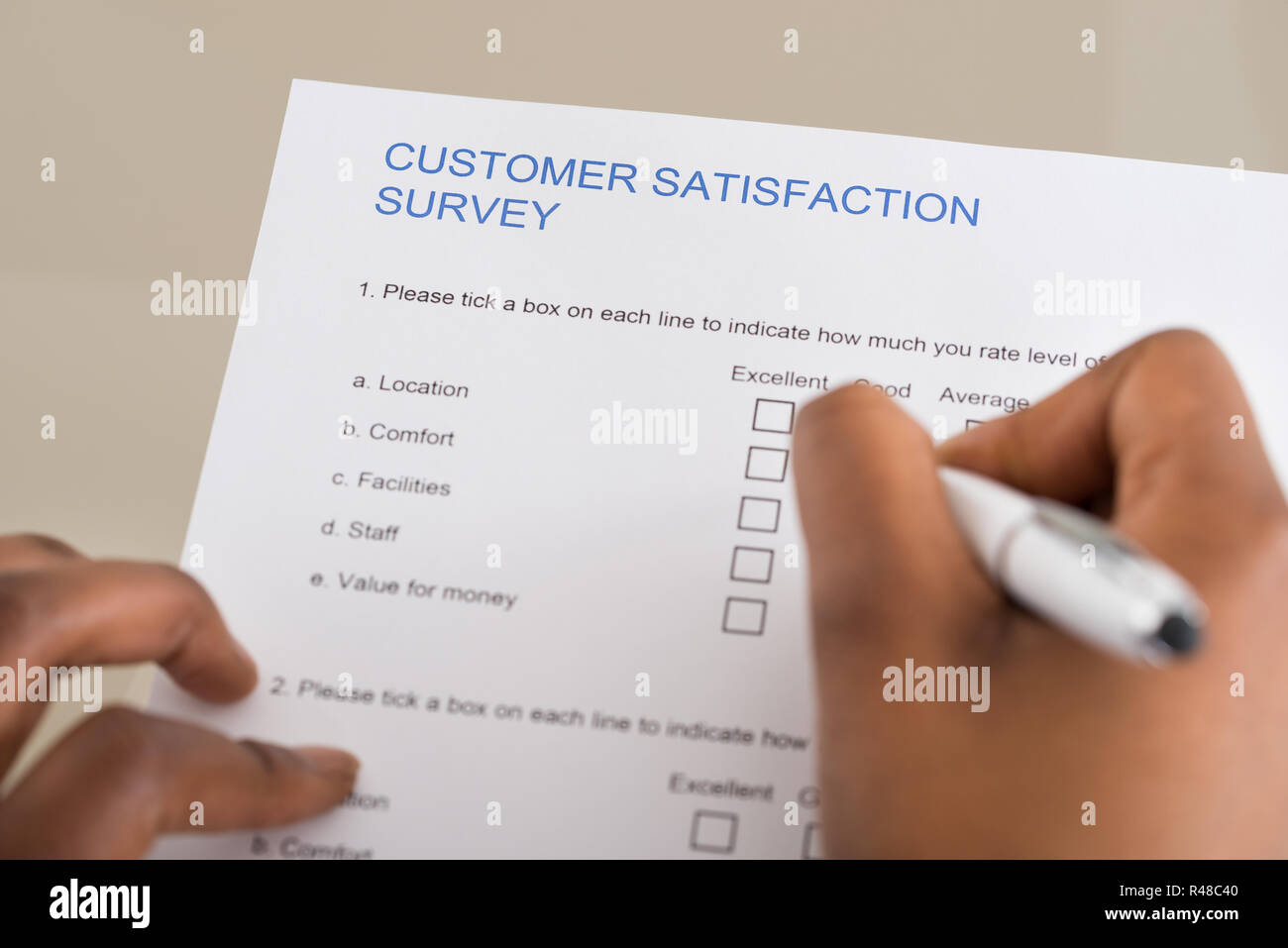 Person Filling Customer Satisfaction Form Stock Photo - Alamy