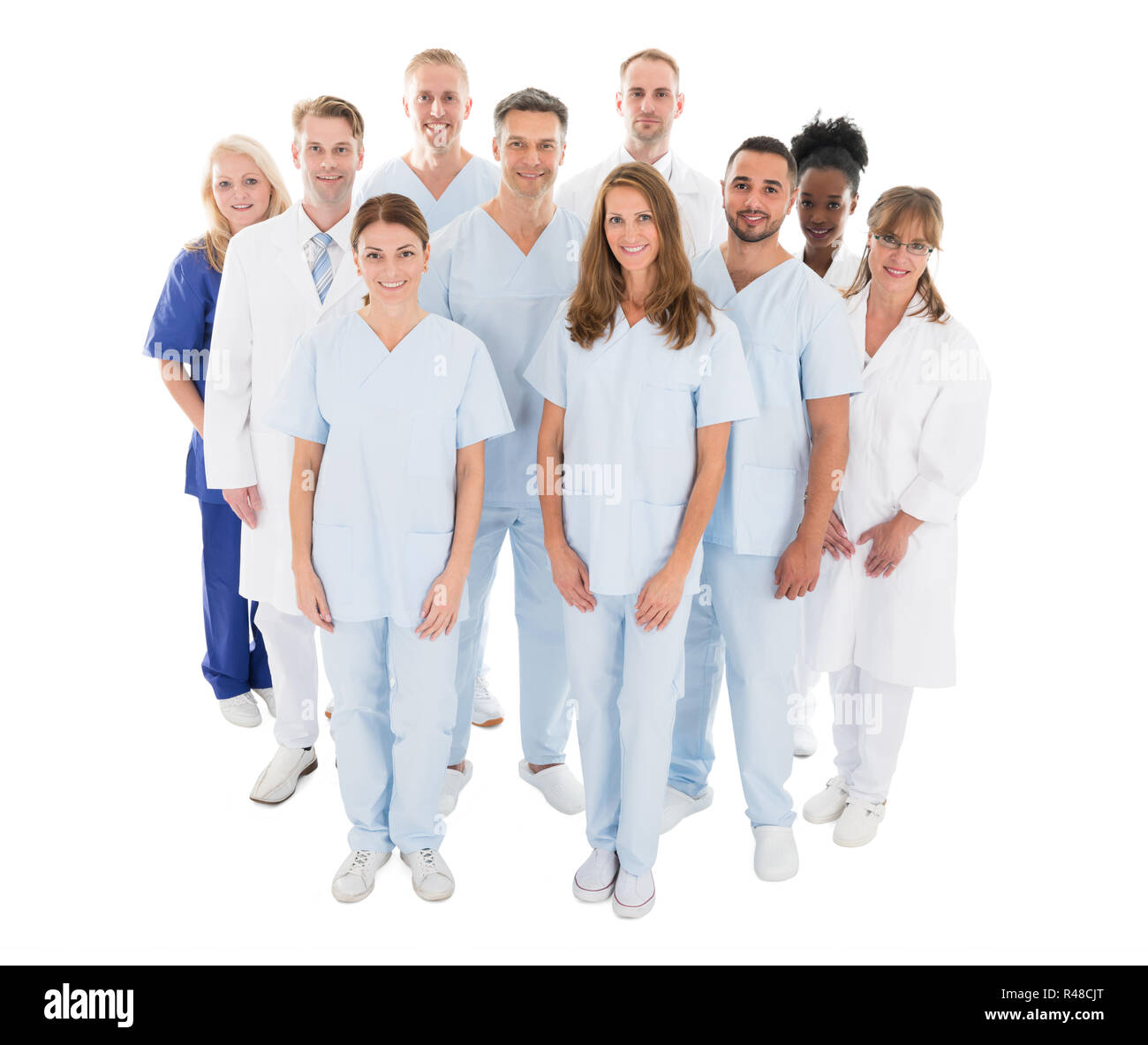 Happy Medical Team Standing Against White Background Stock Photo - Alamy