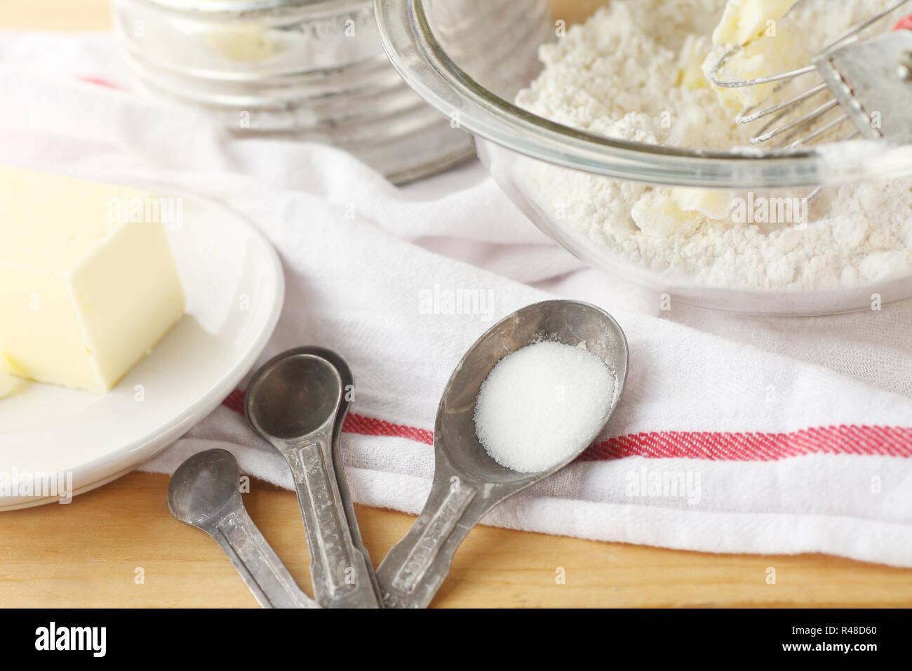 Baking still life with old measuring spoons Stock Photo - Alamy