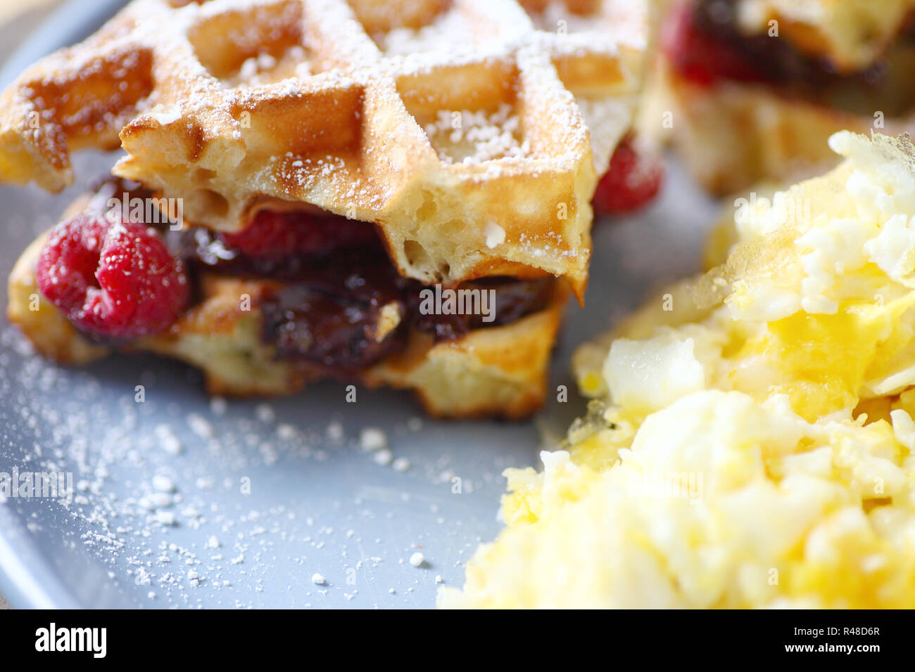 Chocolate and raspberry waffle sandwiches with eggs Stock Photo - Alamy