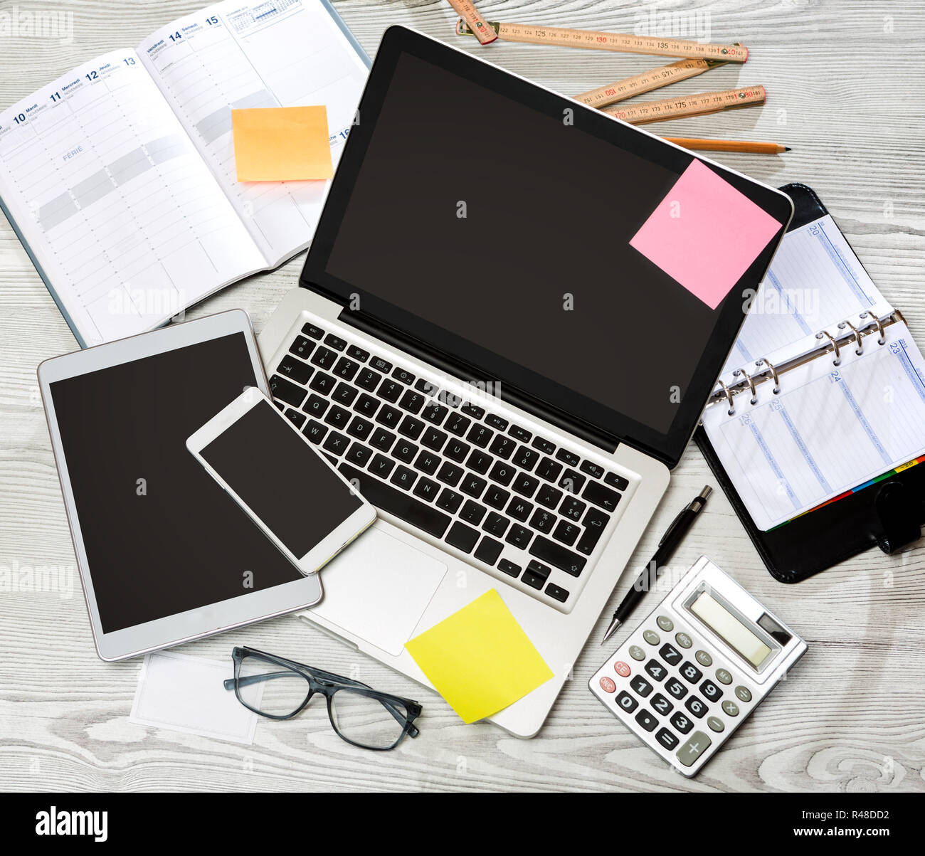 Wood businessman's desk in high definition with laptop, tablet and ...