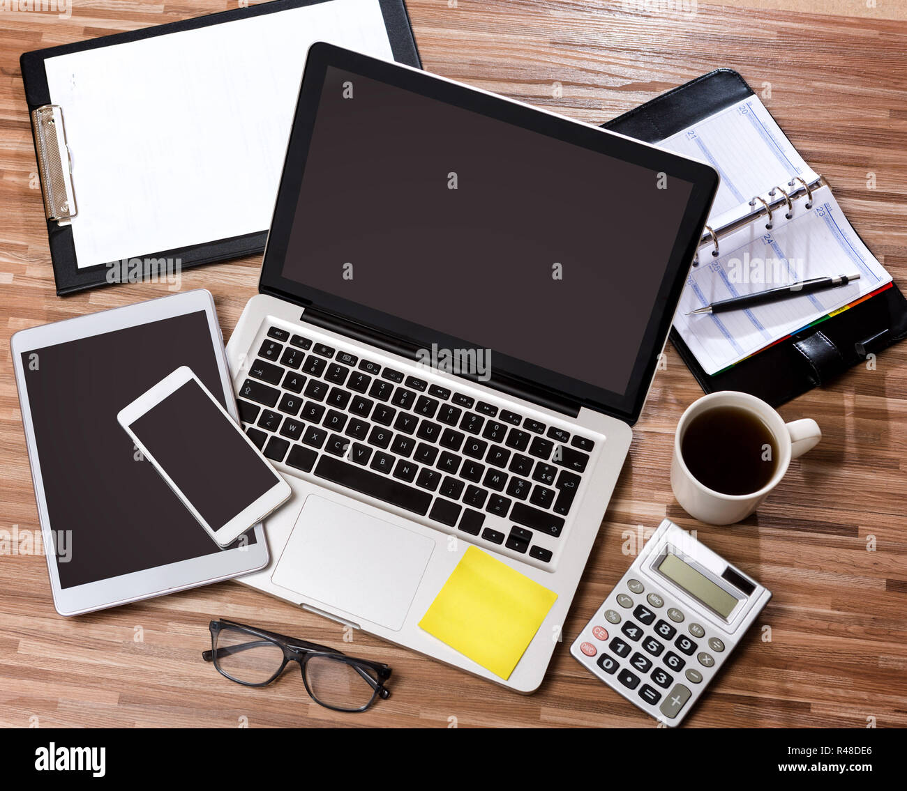 Wood businessman's desk in high definition with laptop, tablet and ...