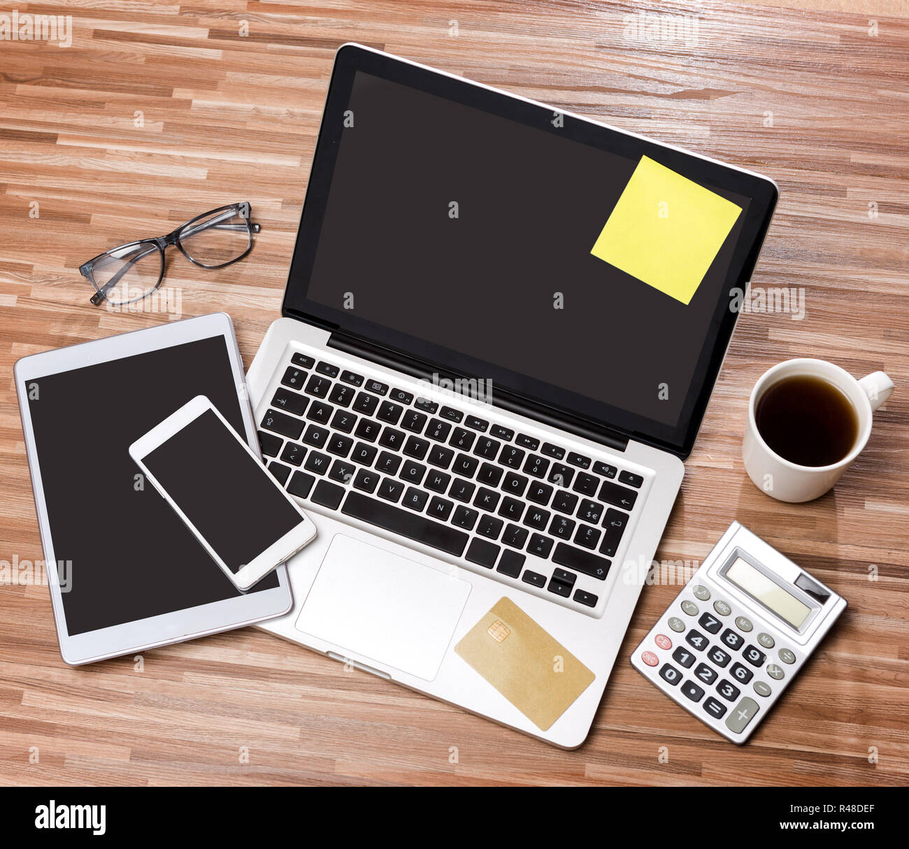 Wood businessman's desk in high definition with laptop, tablet and ...