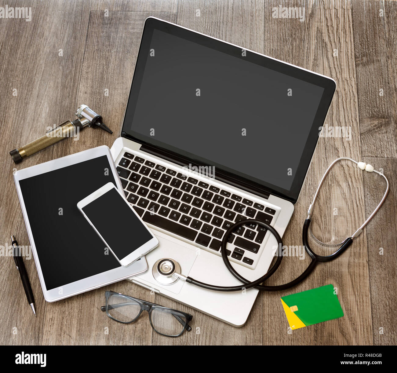 Wood doctor's desk in high definition with laptop, tablet and mobile ...