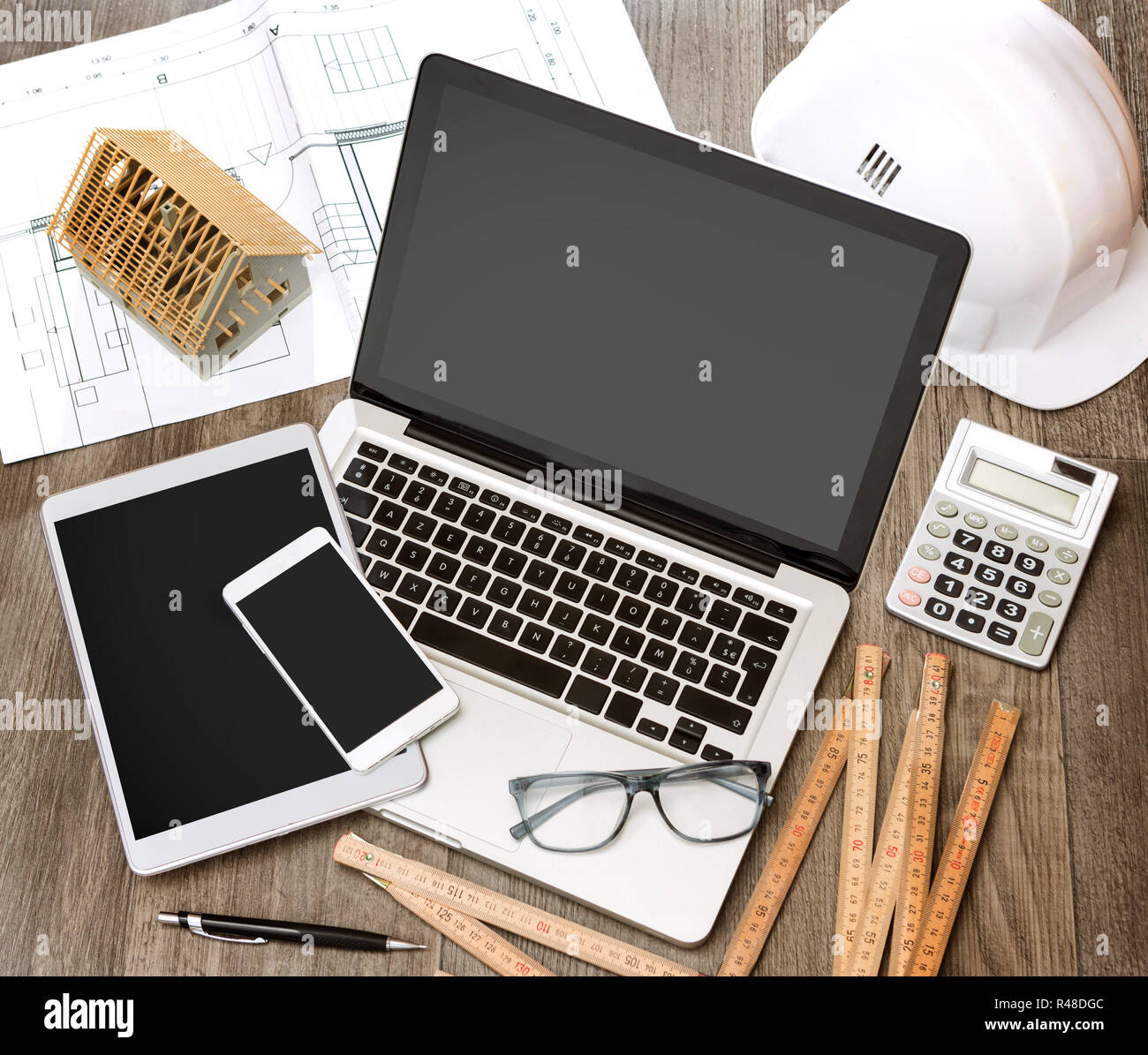 Wood architect's desk in high definition with laptop, tablet and mobile ...
