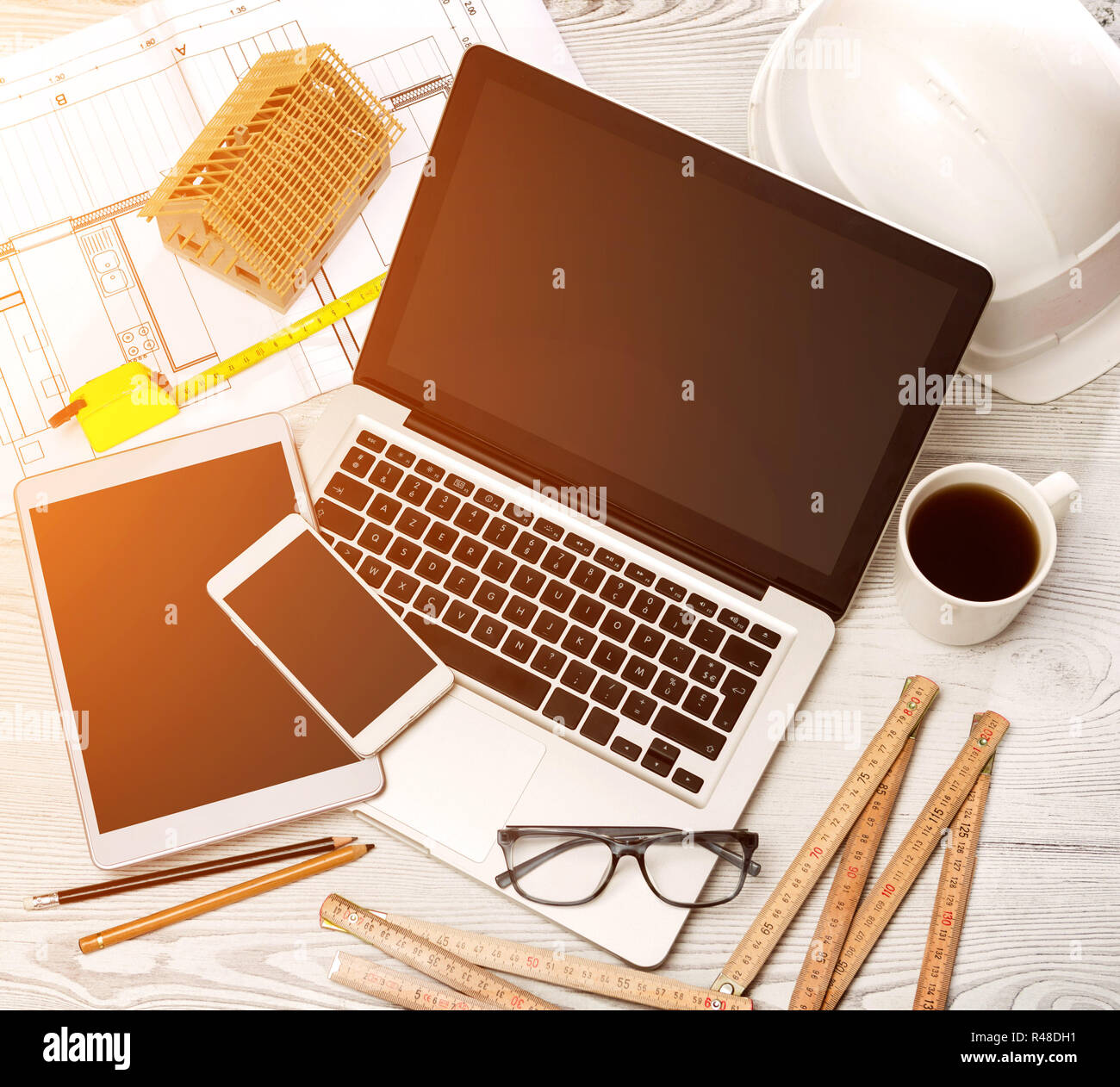 Wood architect's desk in high definition with laptop, tablet and mobile ...