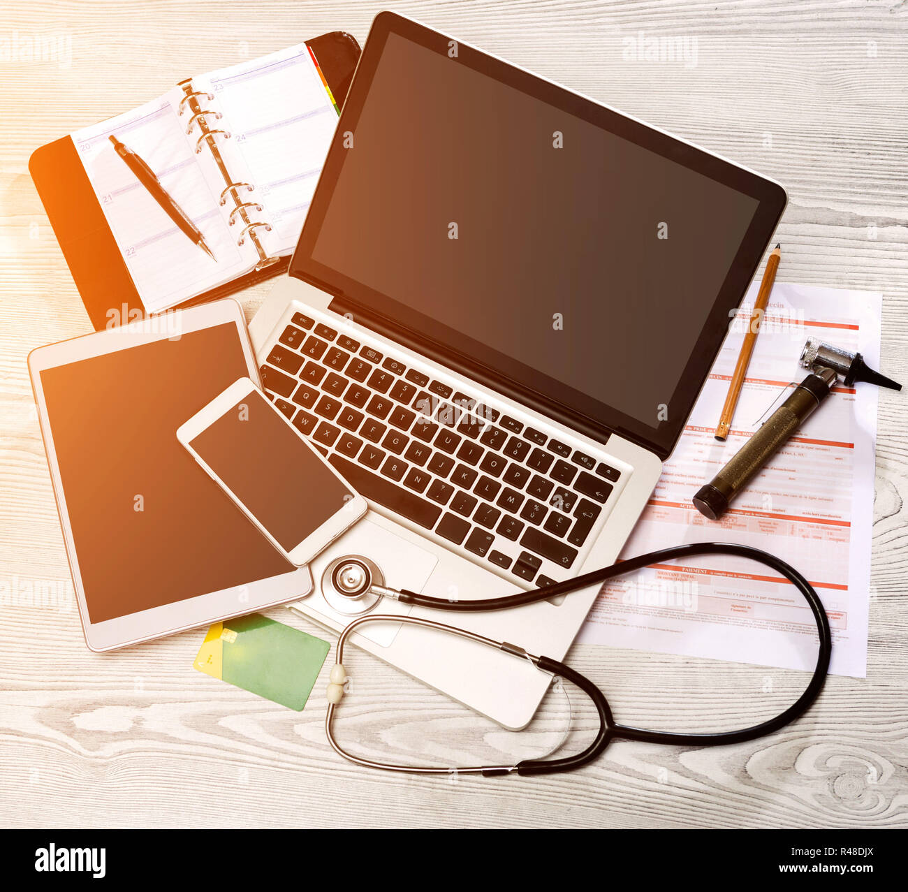 Wood doctor's desk in high definition with laptop, tablet and mobile ...