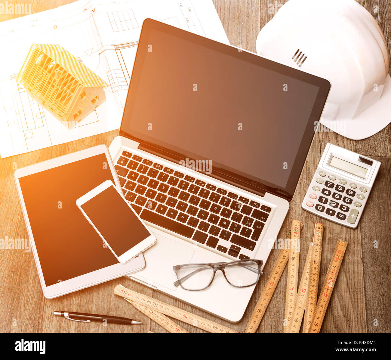 Wood architect's desk in high definition with laptop, tablet and mobile ...
