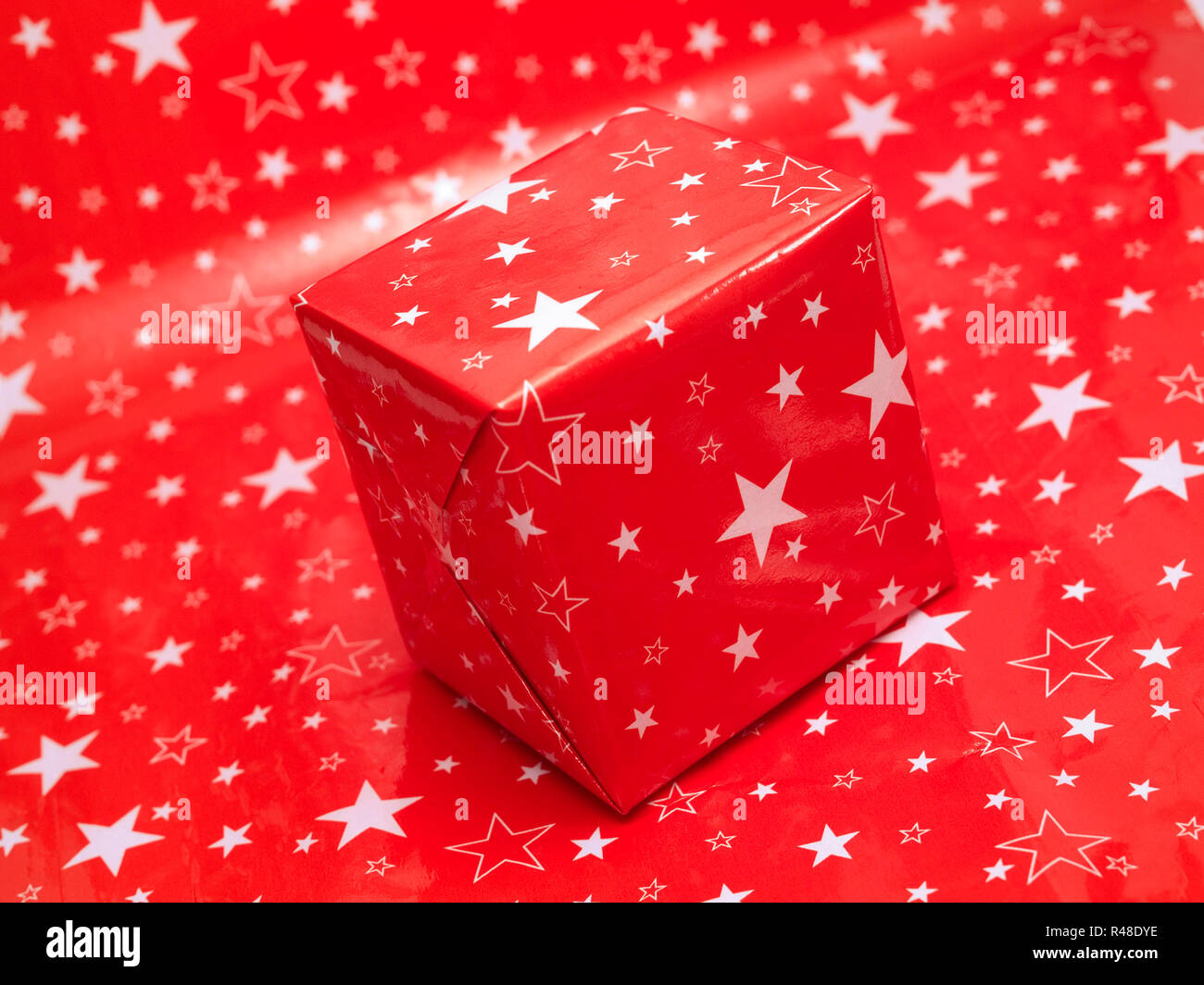 One red present Stock Photo - Alamy