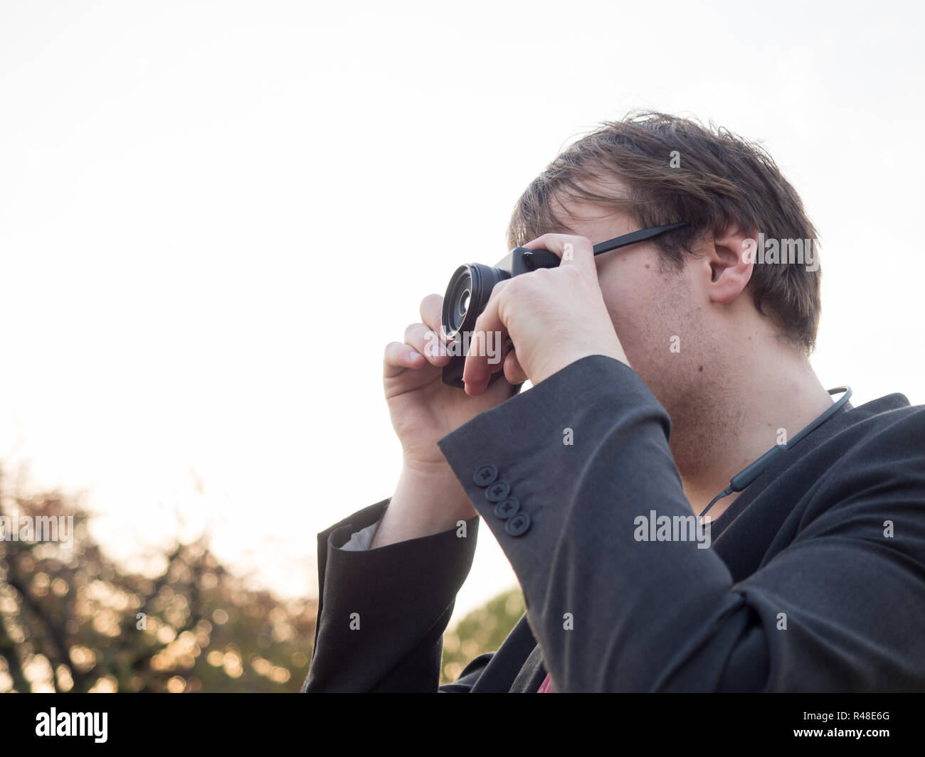 A man taking a picture on his digital camera Stock Photo - Alamy