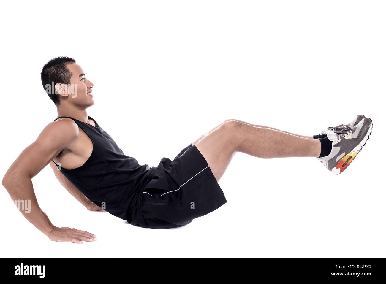 Sports man doing fitness exercise Stock Photo - Alamy
