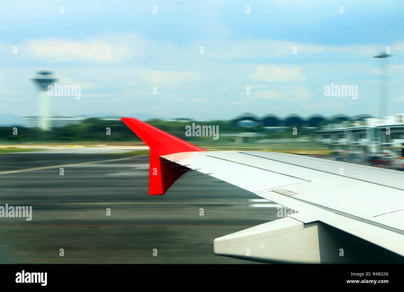 Airplane take off from window view with blur motion Stock Photo - Alamy