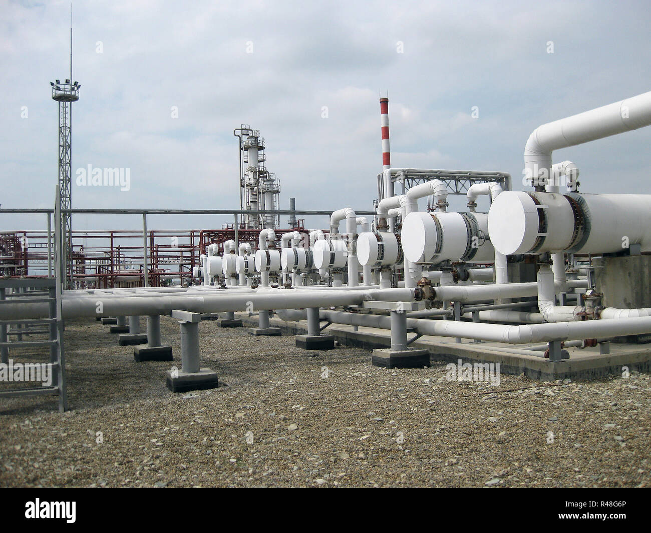 Heat exchangers in a refinery Stock Photo - Alamy