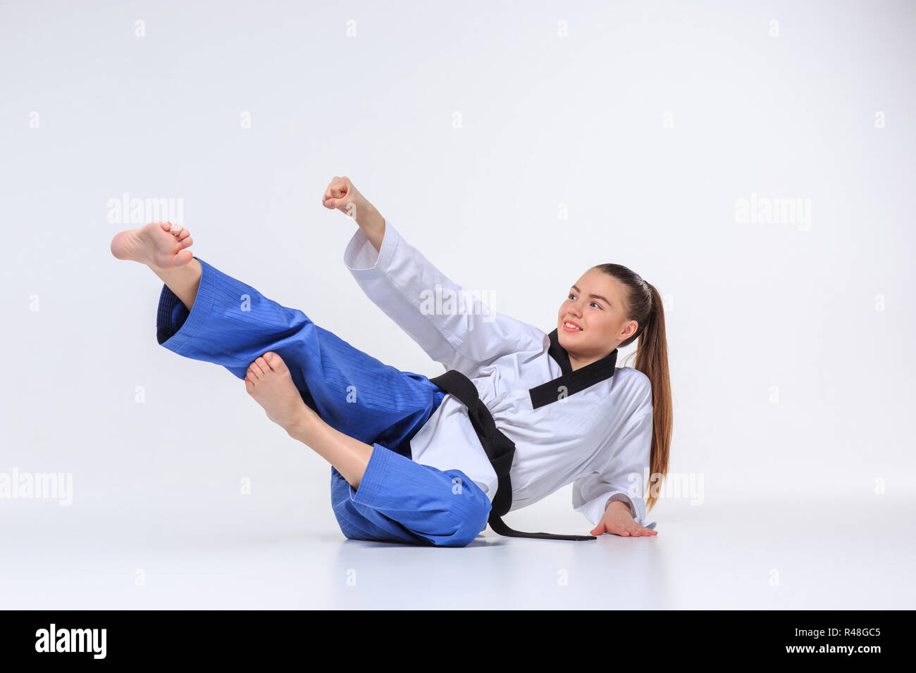 The karate girl with black belt Stock Photo - Alamy
