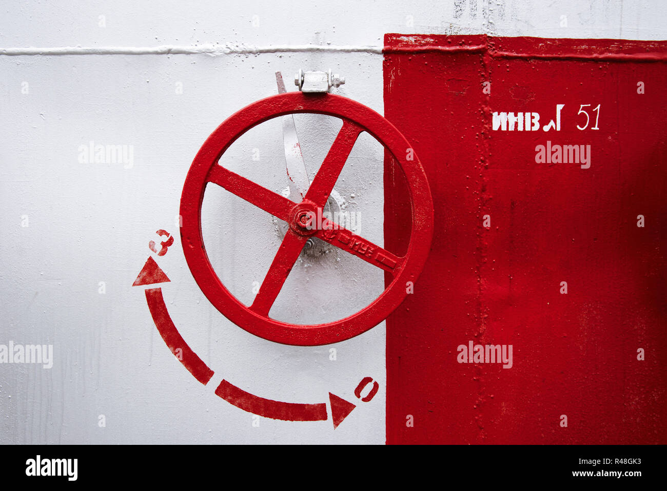 old red hand wheel on the wall of tank Stock Photo - Alamy