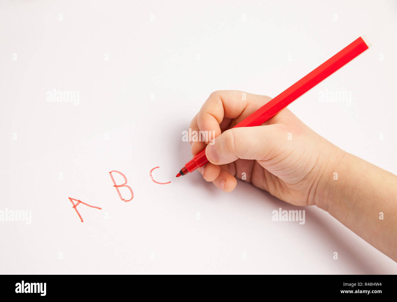 Hand of a child writing letters Stock Photo - Alamy