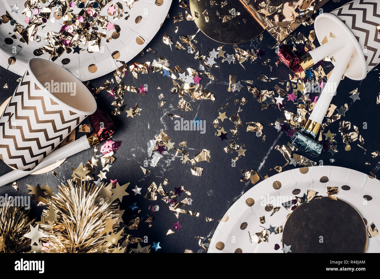 Top view marble table with party cup,party blower,tinsel,confetti.Fun ...