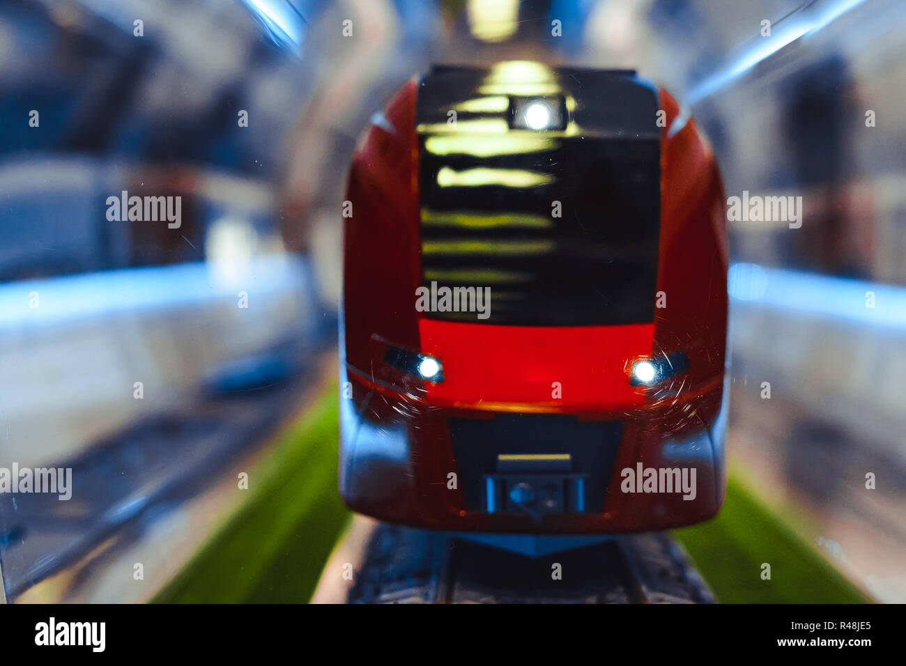 Miniature toy model of modern train crossing bridge Stock Photo - Alamy