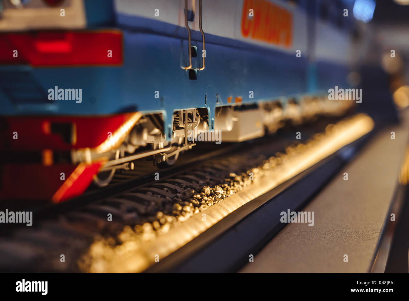 Miniature toy model of modern train crossing bridge Stock Photo - Alamy