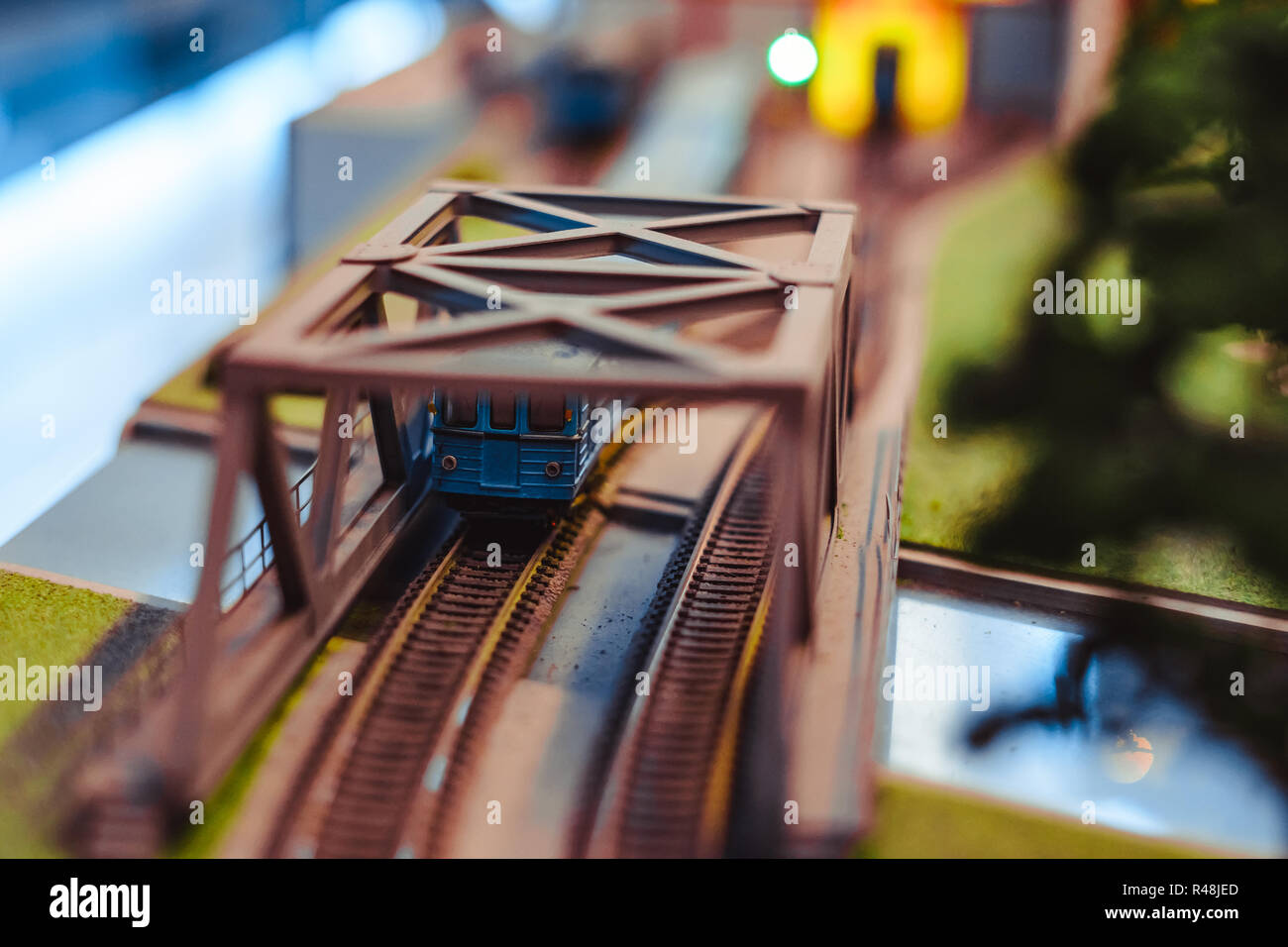 Miniature toy model of modern train crossing bridge Stock Photo - Alamy