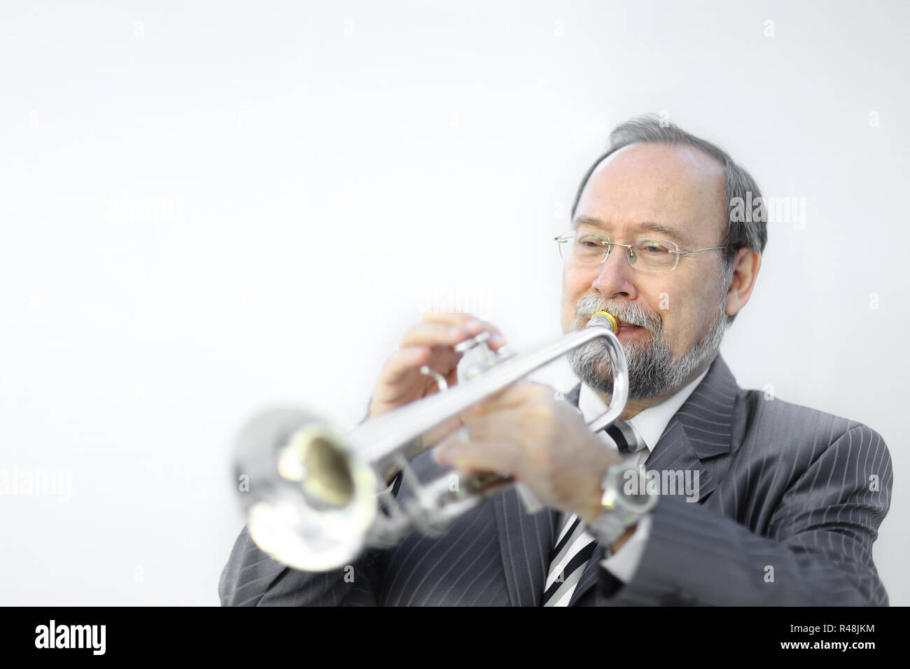 Portrait of a musician playing the trumpet Stock Photo - Alamy