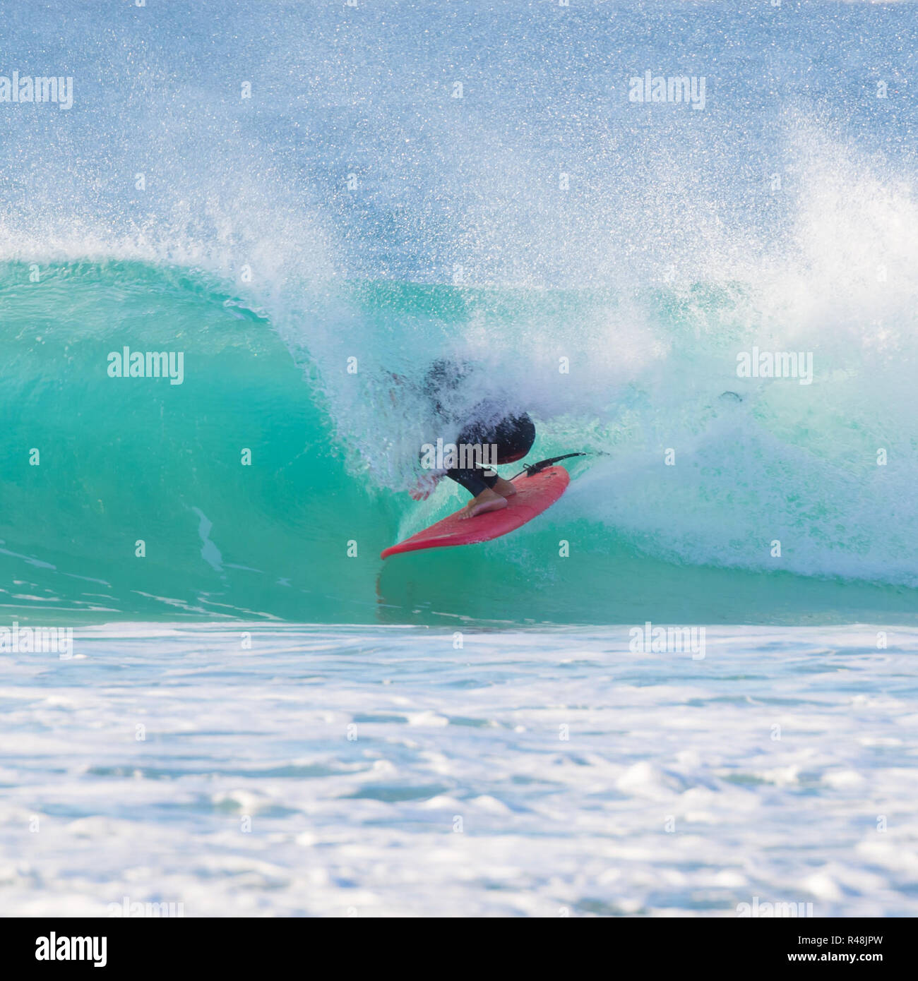 Surfer riding a perfect wave Stock Photo - Alamy