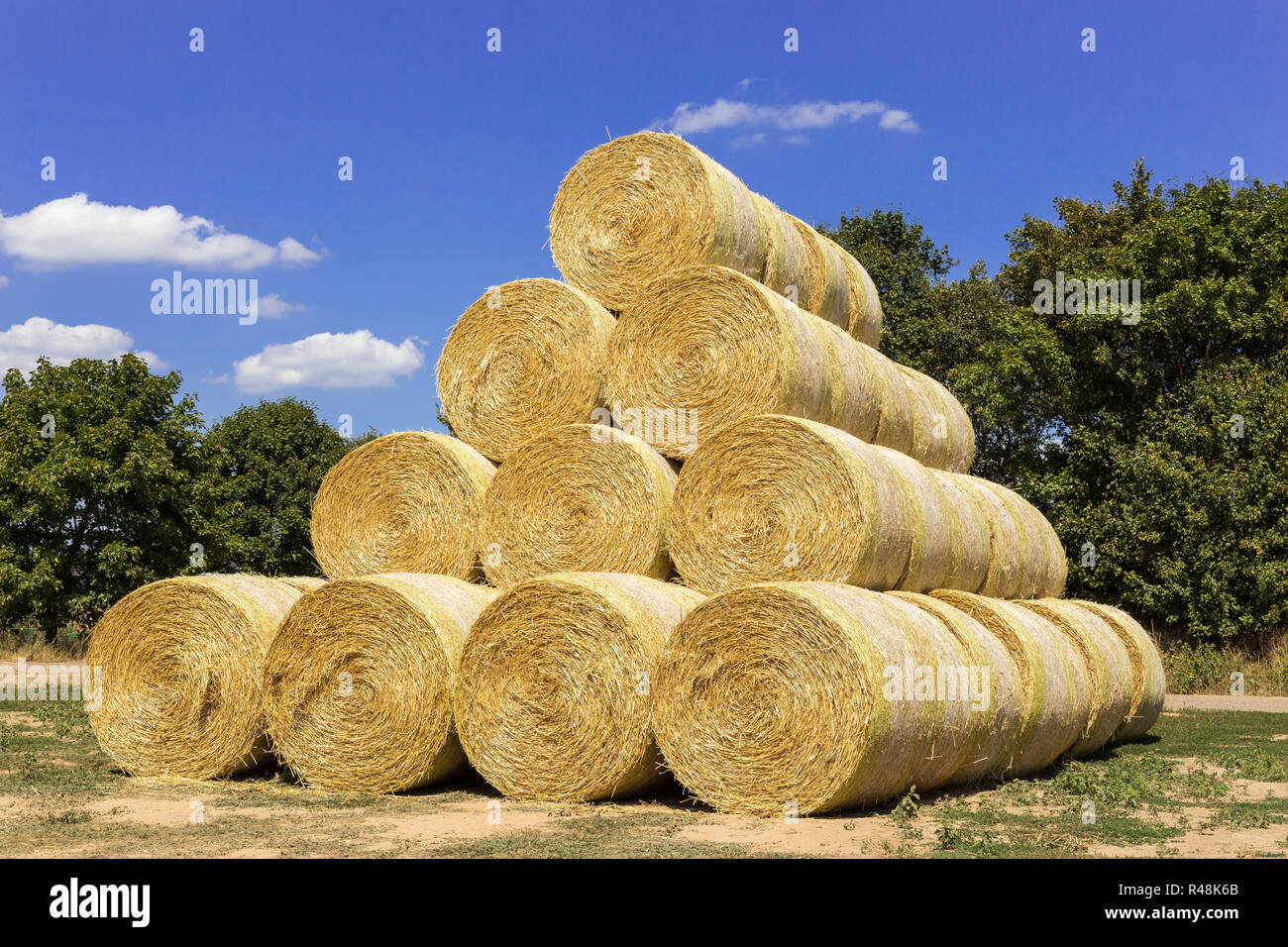 straw ball pyramid at the forest edge Stock Photo - Alamy