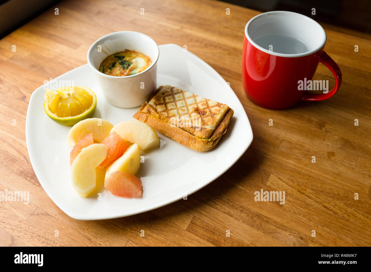 Breakfast with cup of water Stock Photo - Alamy
