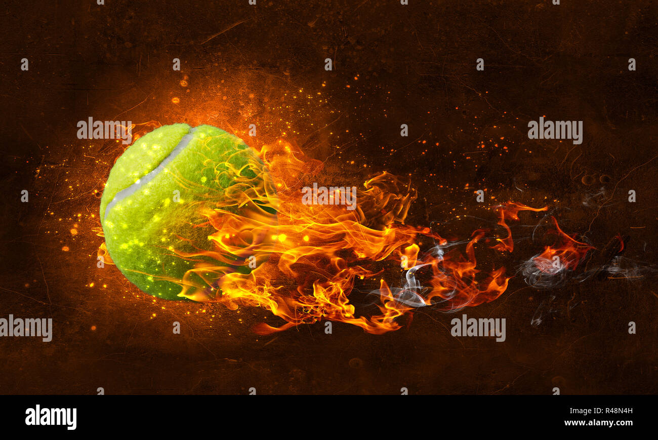 Tennis ball in fire Stock Photo - Alamy
