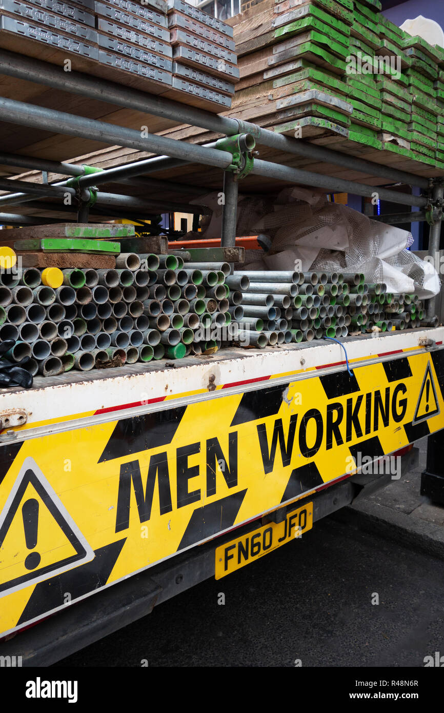 Men Working warning sign on the back of a Lorry in Soho, london Stock ...