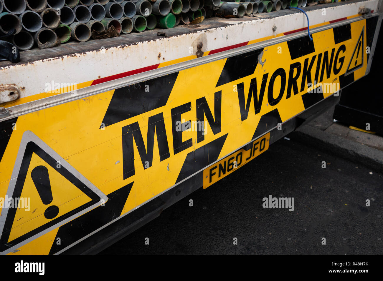 Men Working warning sign on the back of a Lorry in Soho, london Stock ...
