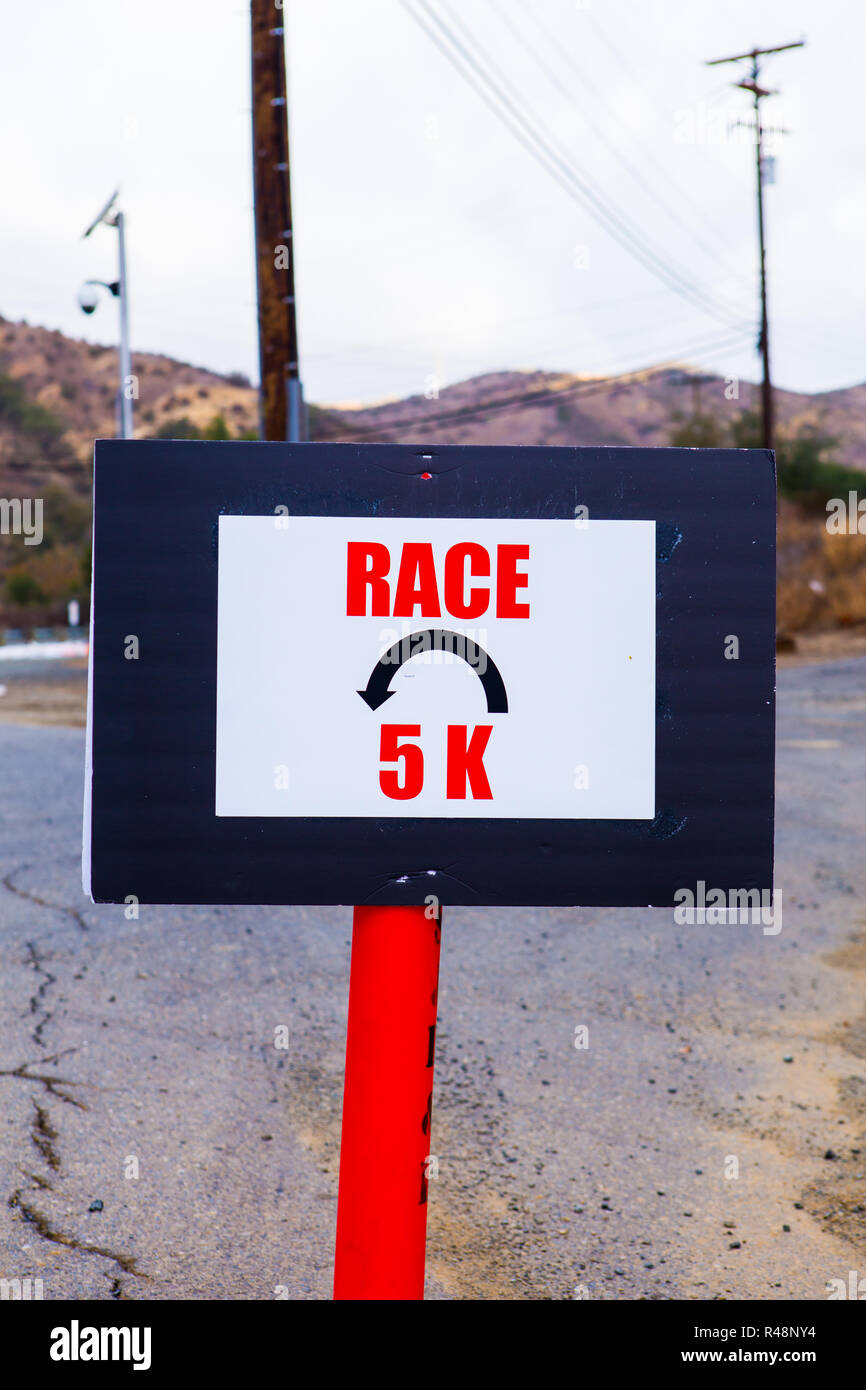 Running road race U Turn sign 5K Stock Photo - Alamy