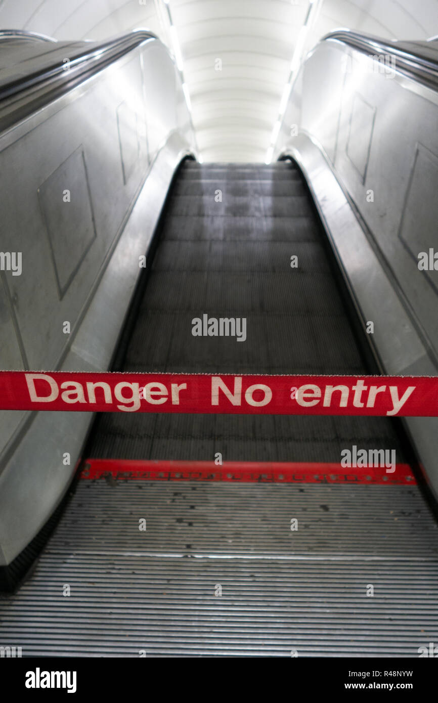 Escalator caution sign hi-res stock photography and images - Alamy