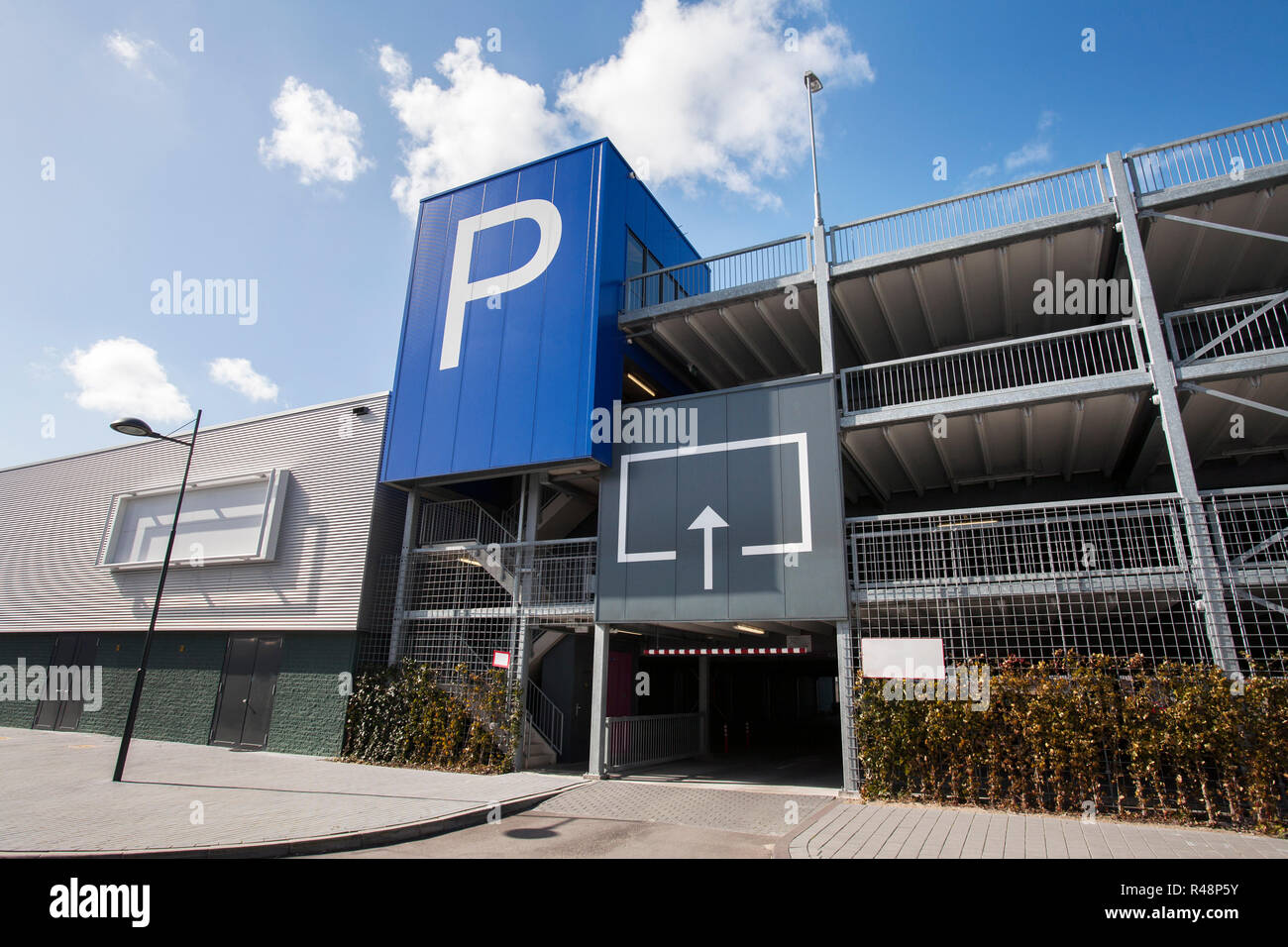 Parking garage with blank billboard Stock Photo - Alamy