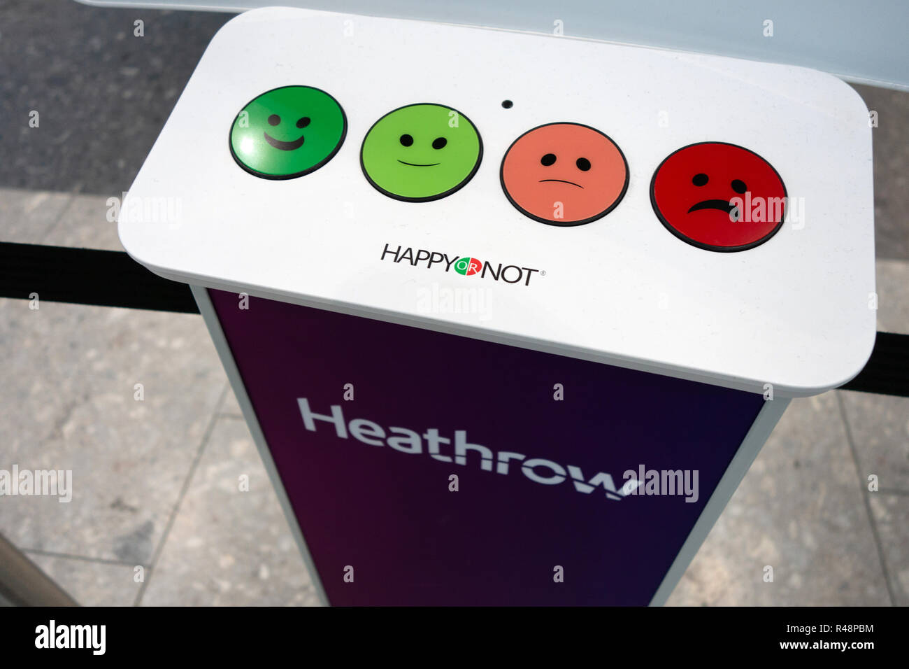 Happy or Not voting for service buttons at Check-in at Heathrow Airport ...